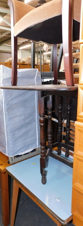 A tub chair, gate leg table, Melamine top table.