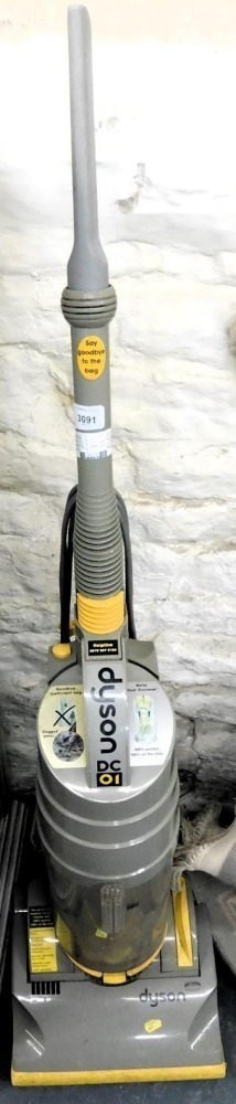 A Dyson DC01 upright vacuum cleaner.