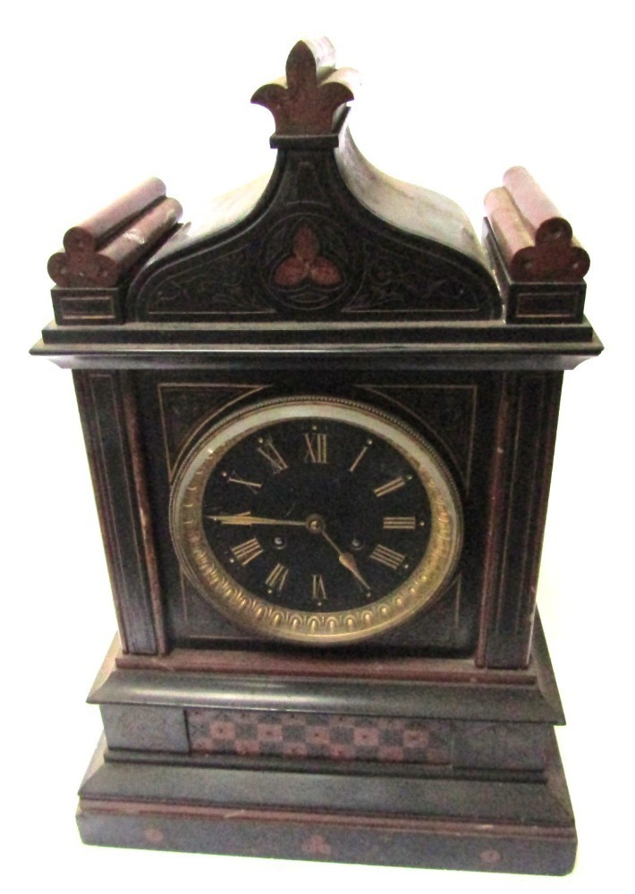 A 19thC French black slate mantel clock, in the Gothic Revival style ...
