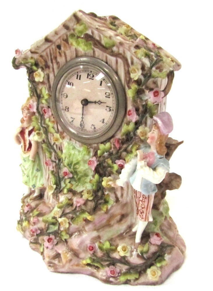 A Dutch Delft porcelain clock, the casing with an arched top depicting ...