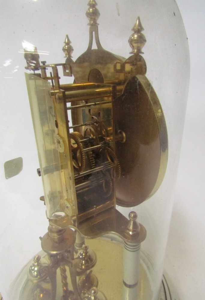 A Kundo anniversary clock, in the French style, with a cream painted ...