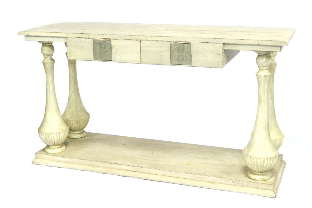 An early 20thC French cream painted console table, with two frieze ...