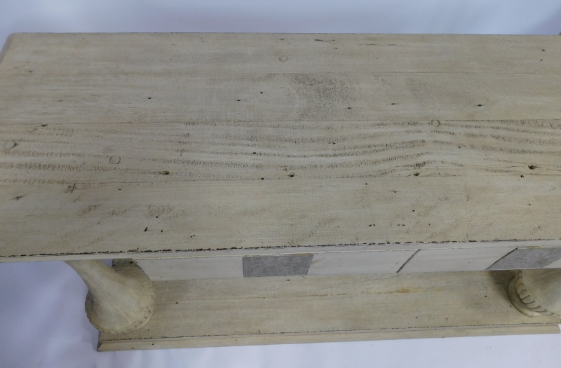 An early 20thC French cream painted console table, with two frieze ...