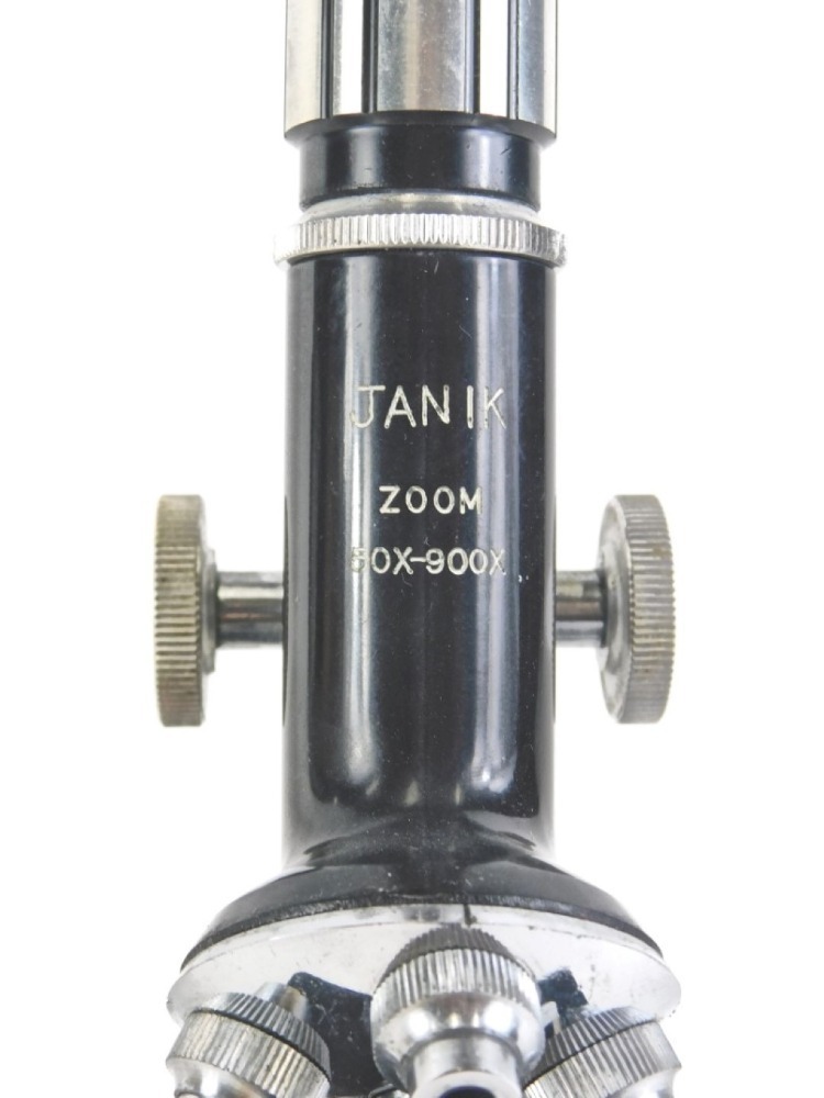 A Janik zoom 50X-900X student's microscope, in wooden case.