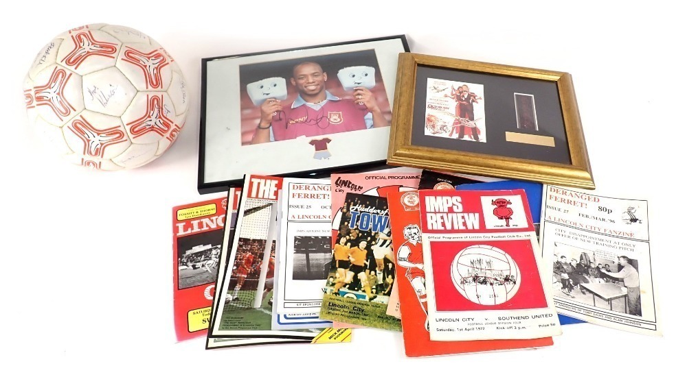 A collection of Lincoln City football memorabilia, to include a signed ...