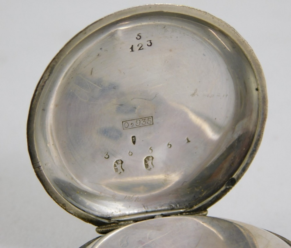 A Victorian silver fob watch, with a heavily engraved floral case, with ...