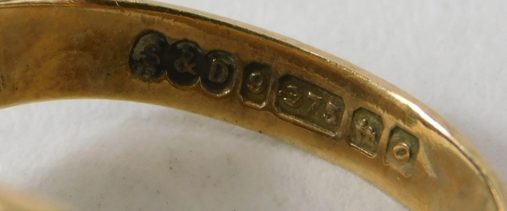 A 9ct gold signet ring, the panel with initials DT, with floral ...