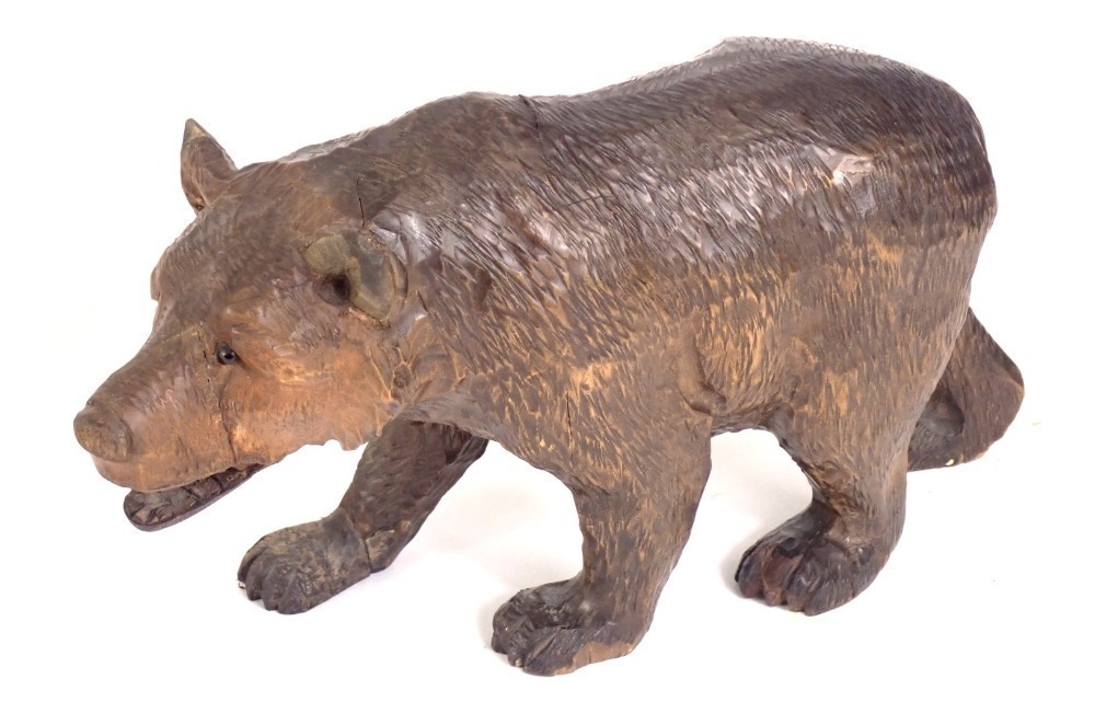 A Black Forest style bear, prowling, 15cm high.