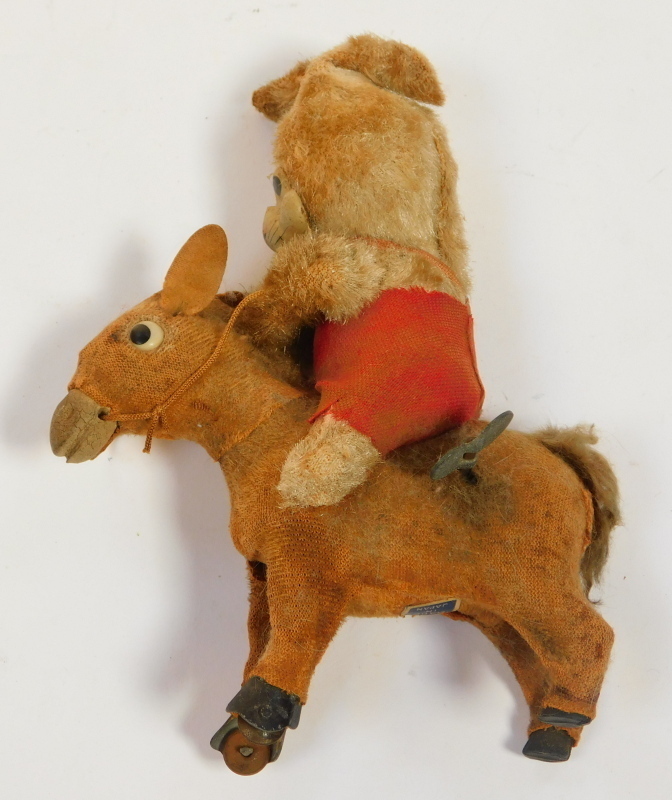 A Japanese clockwork rabbit riding a donkey.