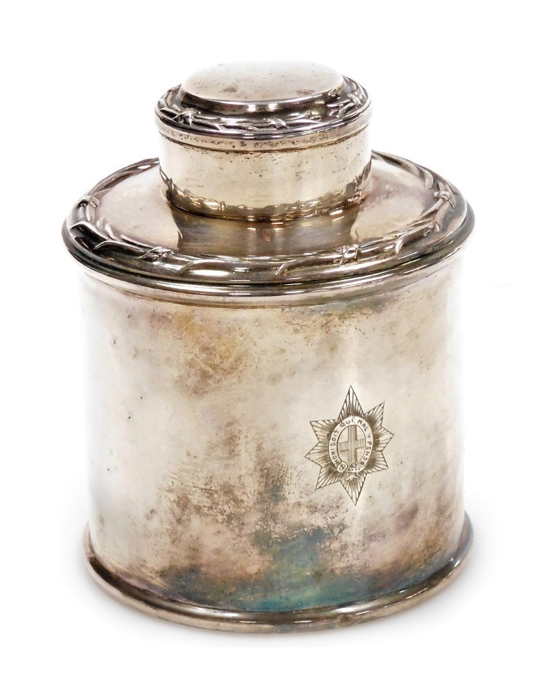 A George III silver tea caddy, of cylindrical form, embossed with ...