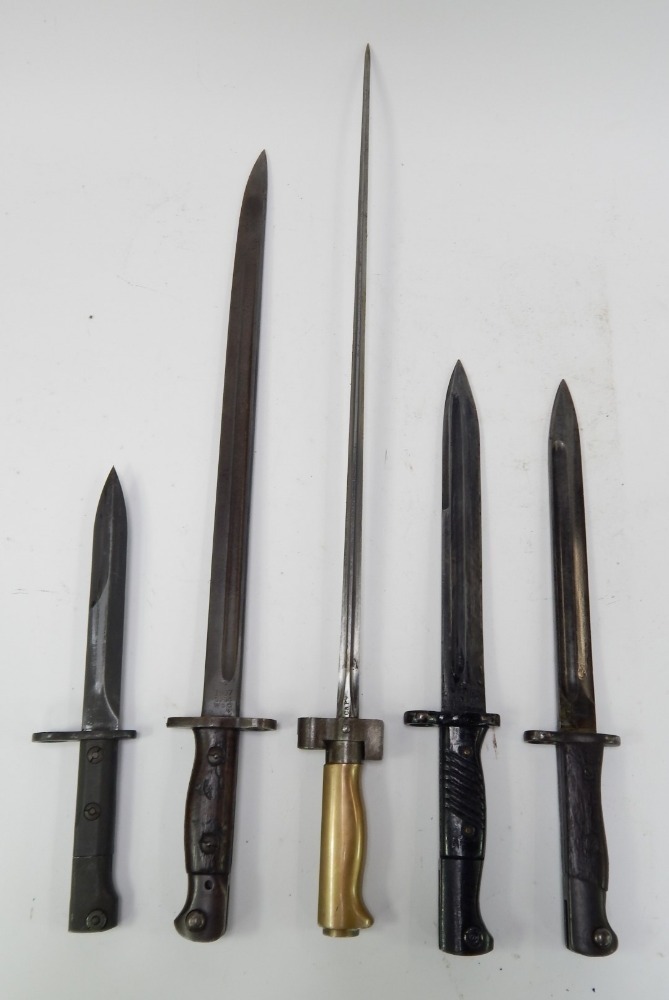 Five bayonets, comprising an Austrian 1873 model, a Remington, and ...