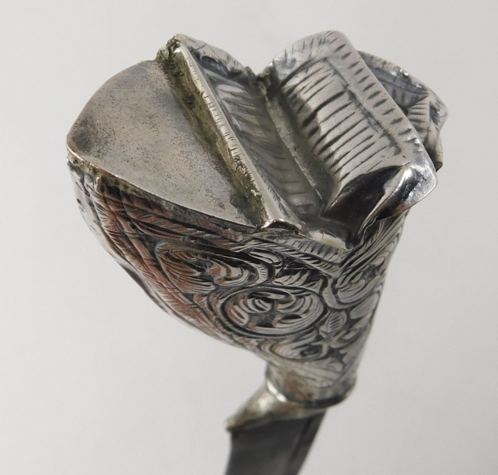 A Malay Sawar white metal mounted dagger, with engraved mounts, horn ...