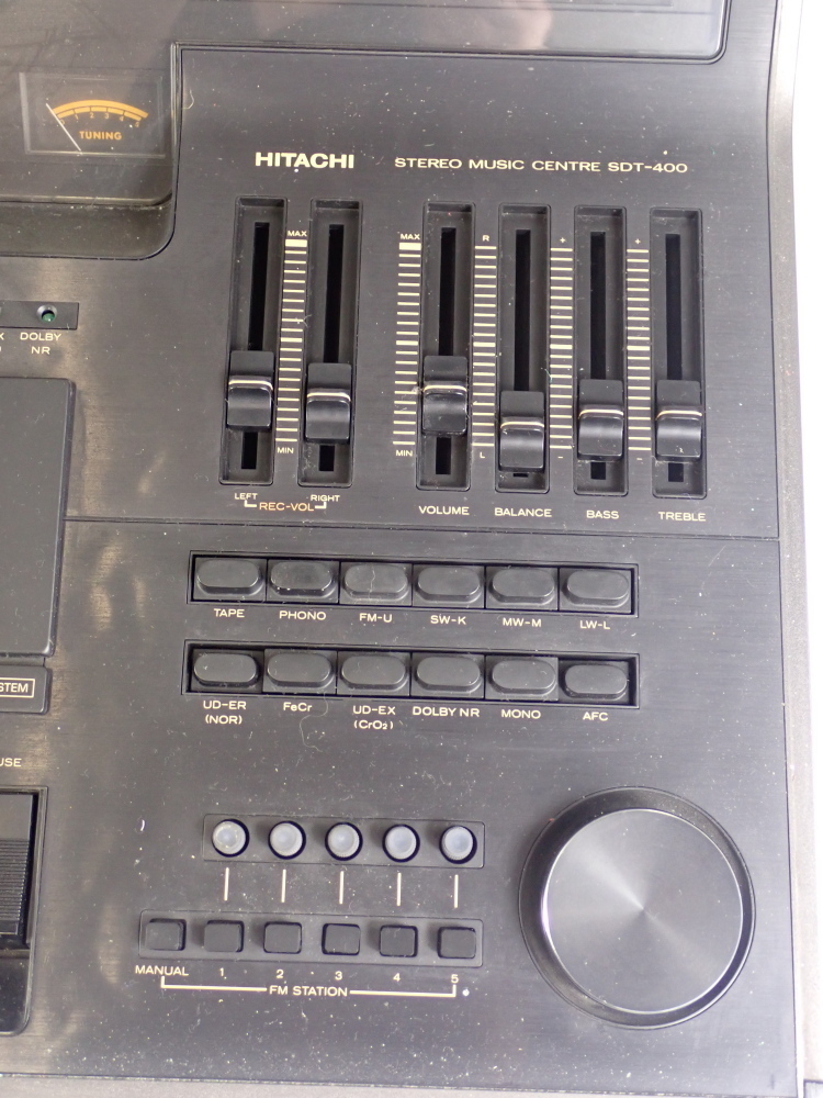 A Hitachi music system with belt drive turntable, cassette recorder ...
