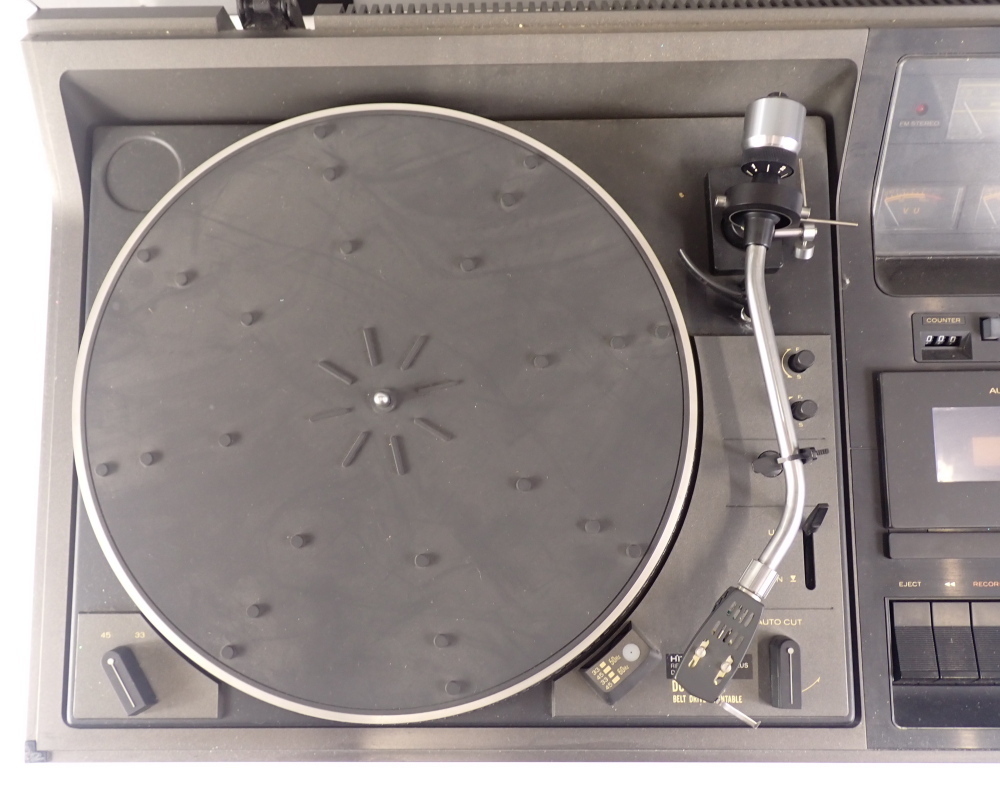A Hitachi music system with belt drive turntable, cassette recorder ...