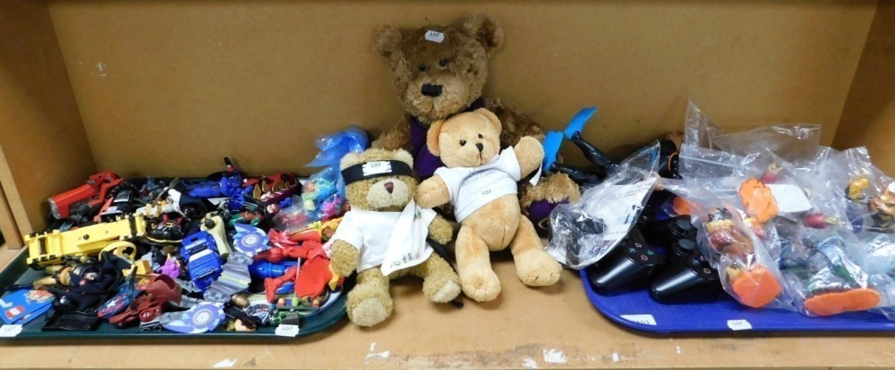 A quantity of small toys, Playstation controller, Action Man and three ...