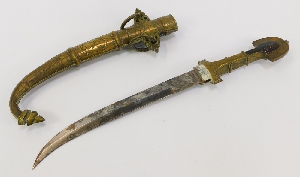 A Moroccan Koummya dagger, the scabbard and hilt intricately decorated ...