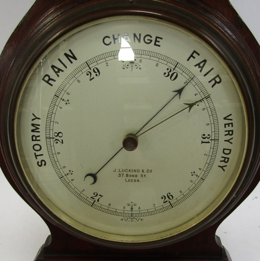 A late 19th/early 20thC mahogany and inlaid wall barometer, the ...