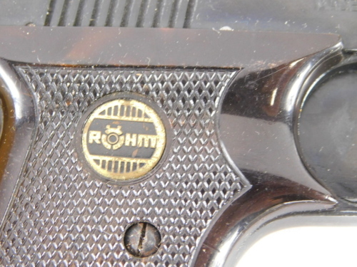 A Rohm RG3 starting pistol, various bullets, musket balls, etc.