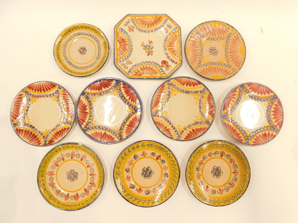 A collection of 1930s Henriot Quimper Faience cups and saucers, various ...