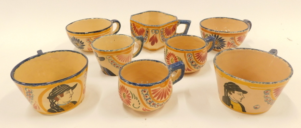 A collection of 1930s Henriot Quimper Faience cups and saucers, various ...