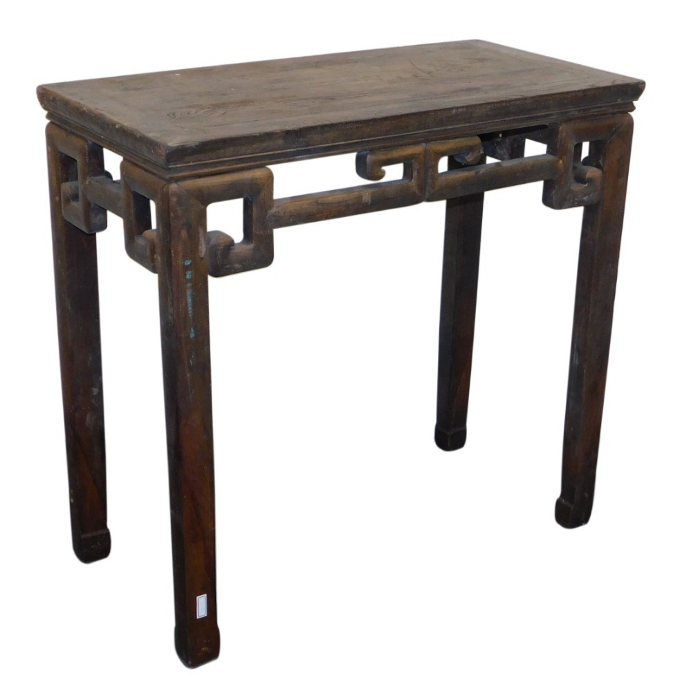 A Chinese elm side table, with a rectangular top, over a geometric ...