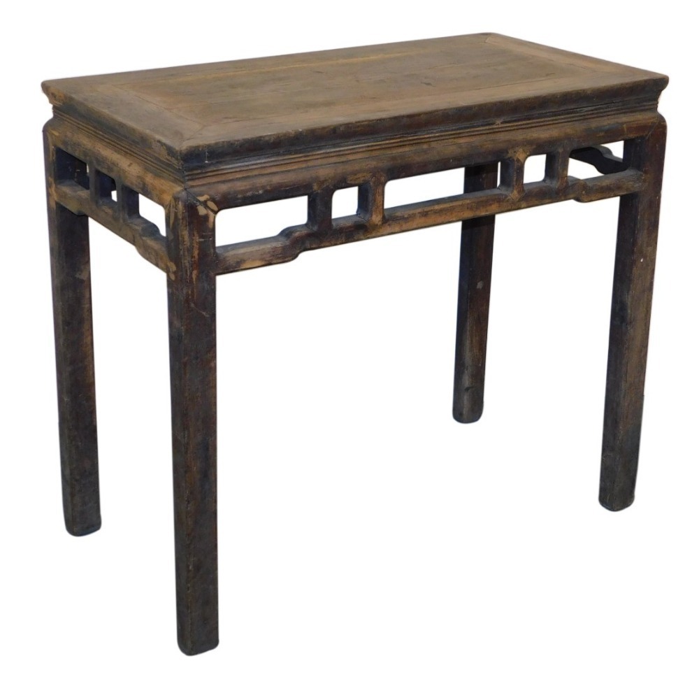 A Chinese elm side table, with a carved frieze, raised on square legs ...