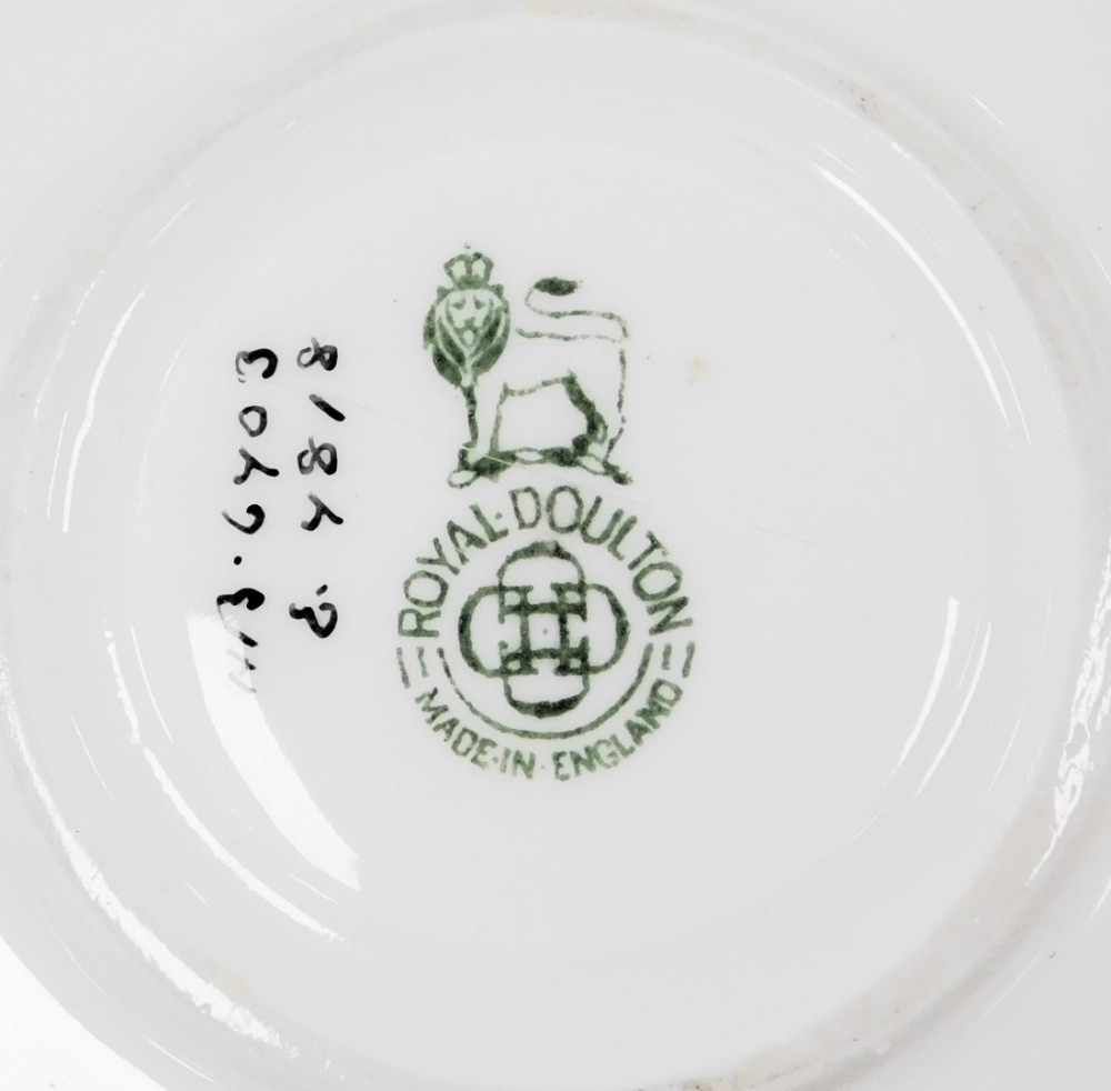 Two cabinet cups and saucers, one Royal Doulton, one Royal Worcester, Artist R .Austin.