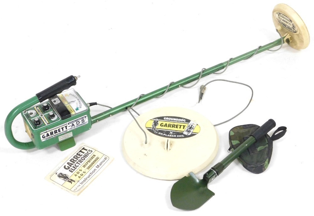 A Garrett Electronics Master Hunter metal detector, with stand and ...