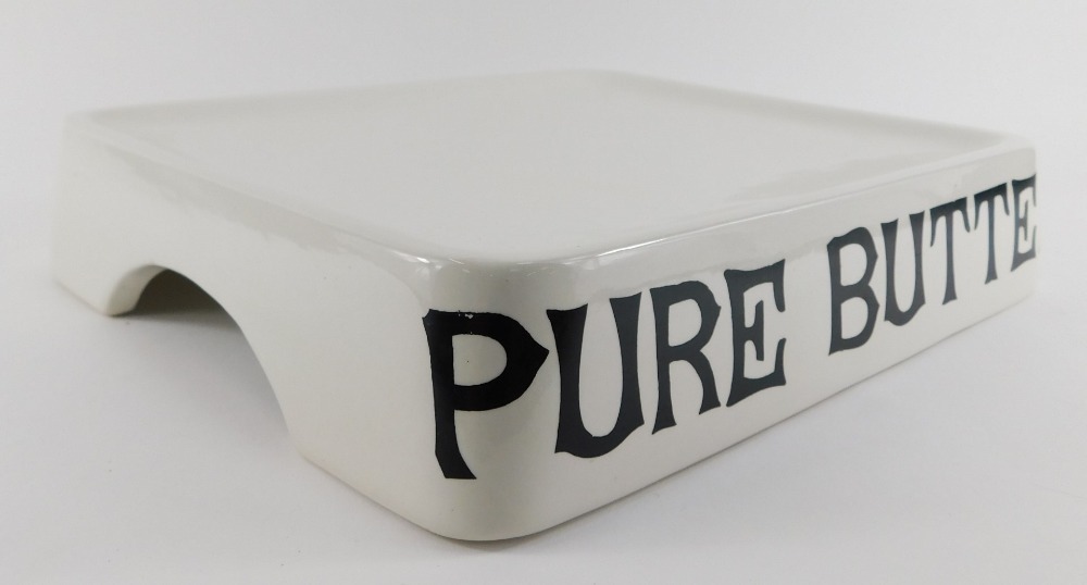 A late 20thC ironstone butter slab, decorated with typography to the ...