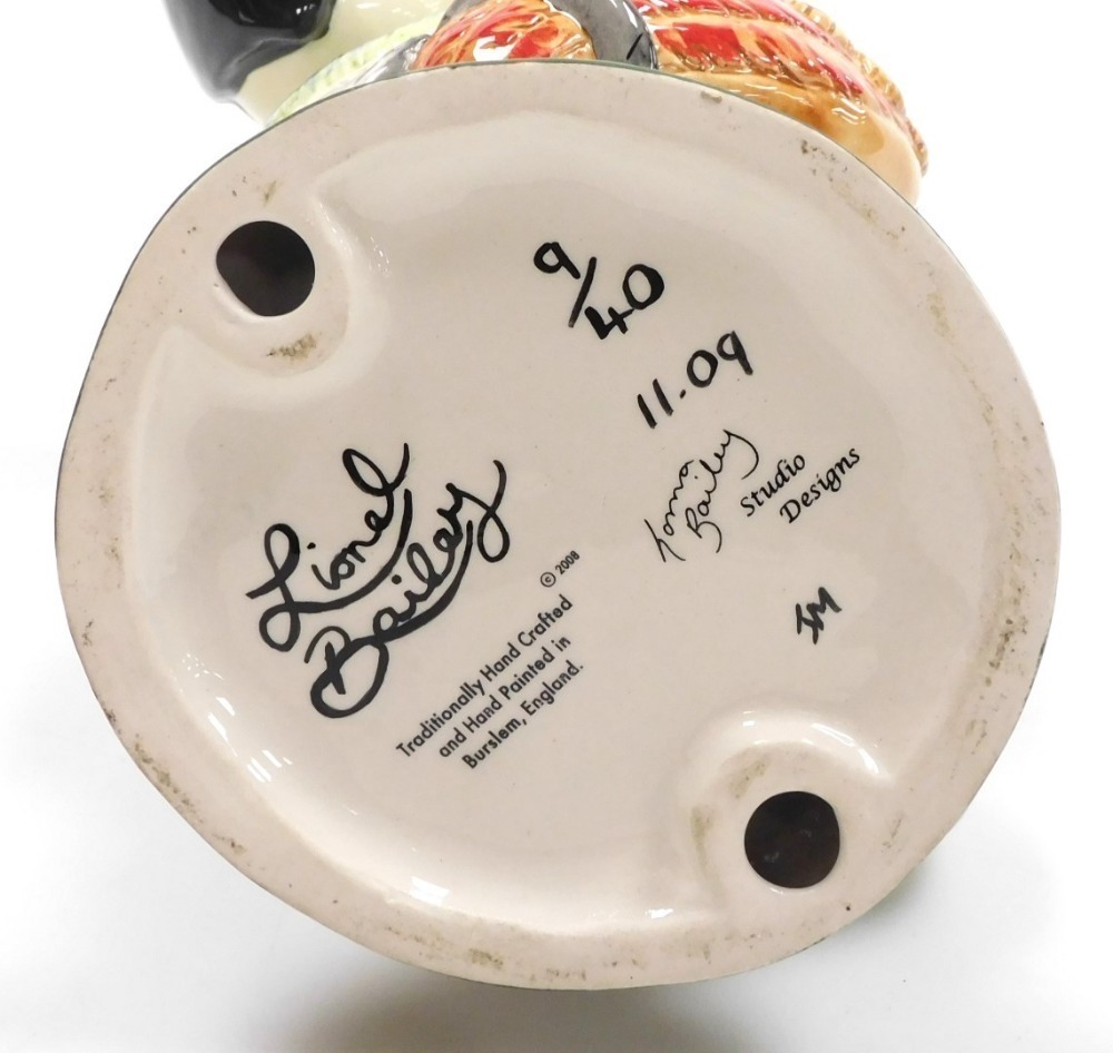 A Lorna Bailey pottery figure of a crying Dodo, it's wings cuffed ...