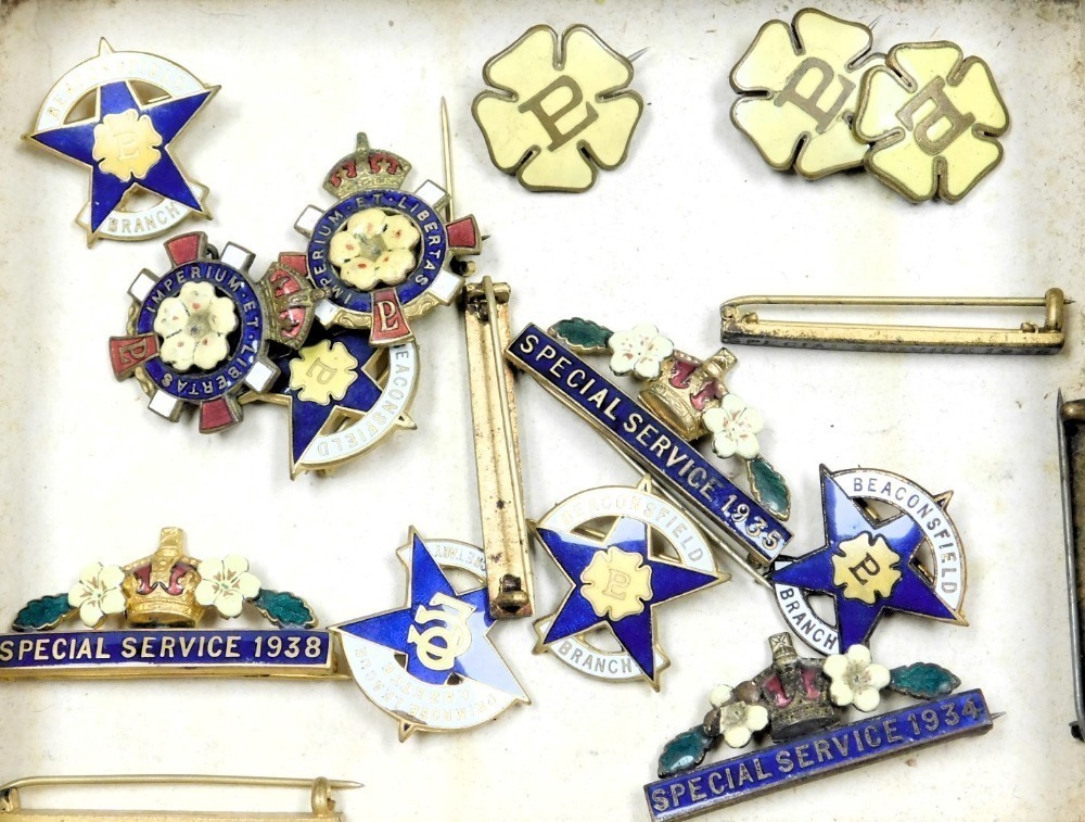 A group of Primrose League badges, two enamel badges with motto ...