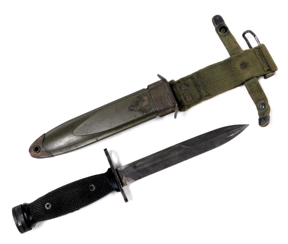A US M8 bayonet, in a US M8 A1 scabbard.