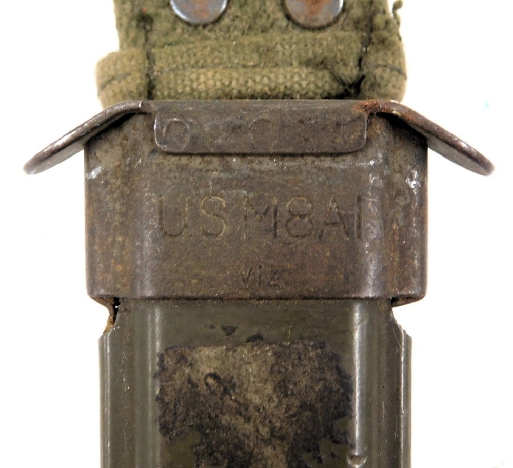 A US M8 bayonet, in a US M8 A1 scabbard.