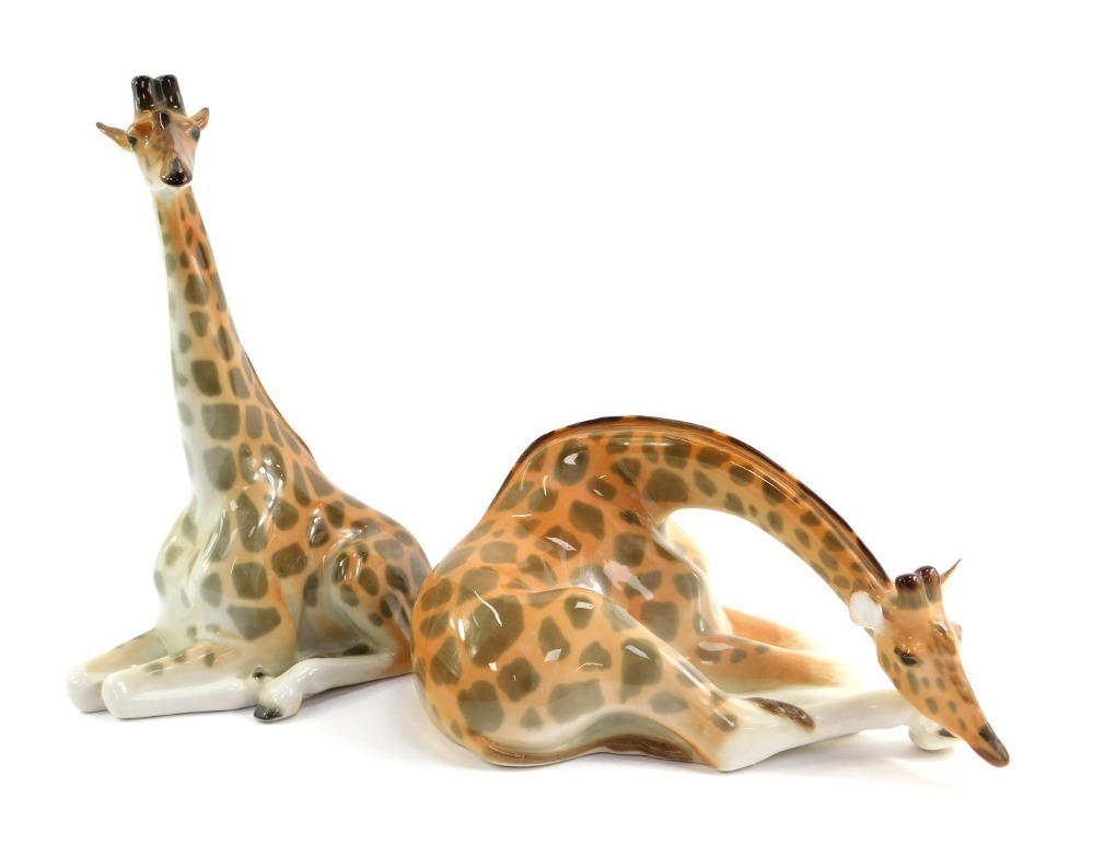 Two Russian Lomonosov porcelain giraffes, one in recumbent pose, 13.5cm ...