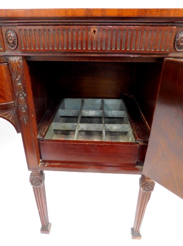 An early 20thC figured and flame mahogany Adam Revival sideboard, with ...