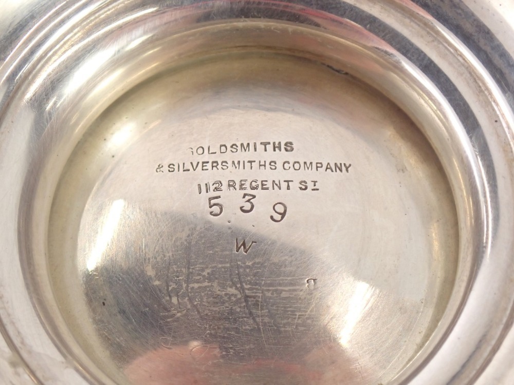 A Goldsmiths and Silversmiths Company silver rose bowl, with vacant ...