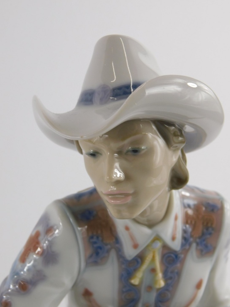 A pair of Lladro country music players, comprising lady with banjo and ...