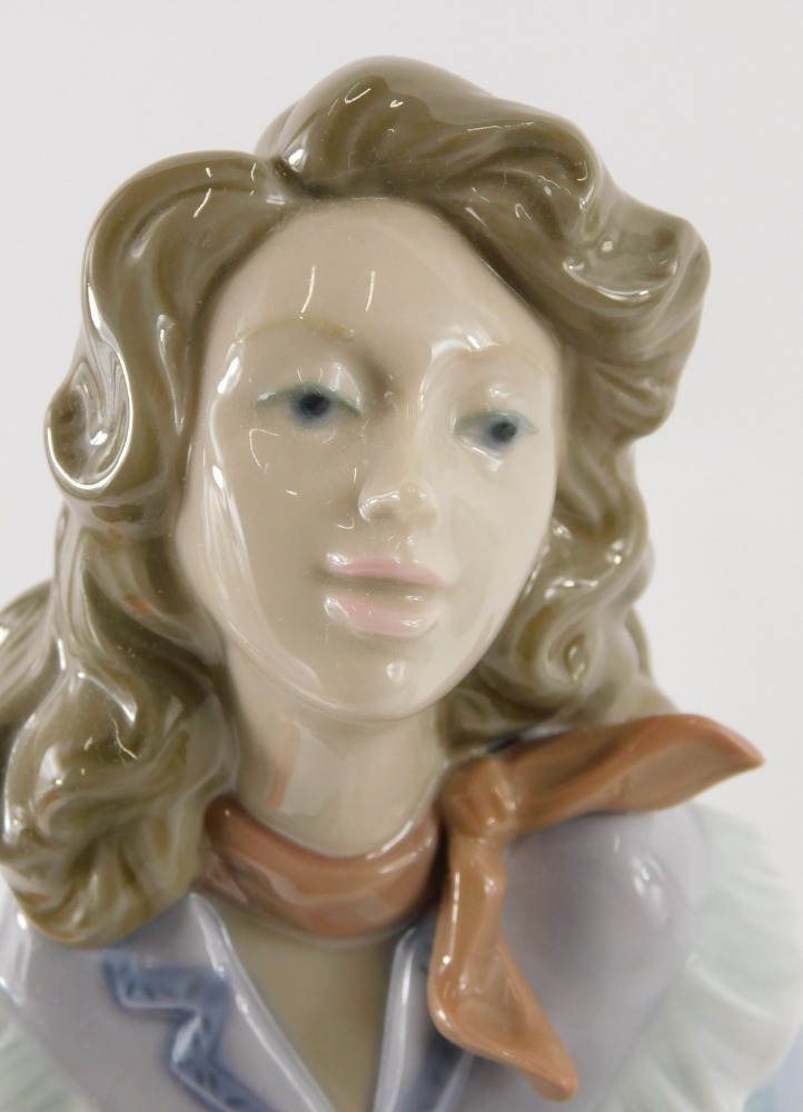 A pair of Lladro country music players, comprising lady with banjo and ...