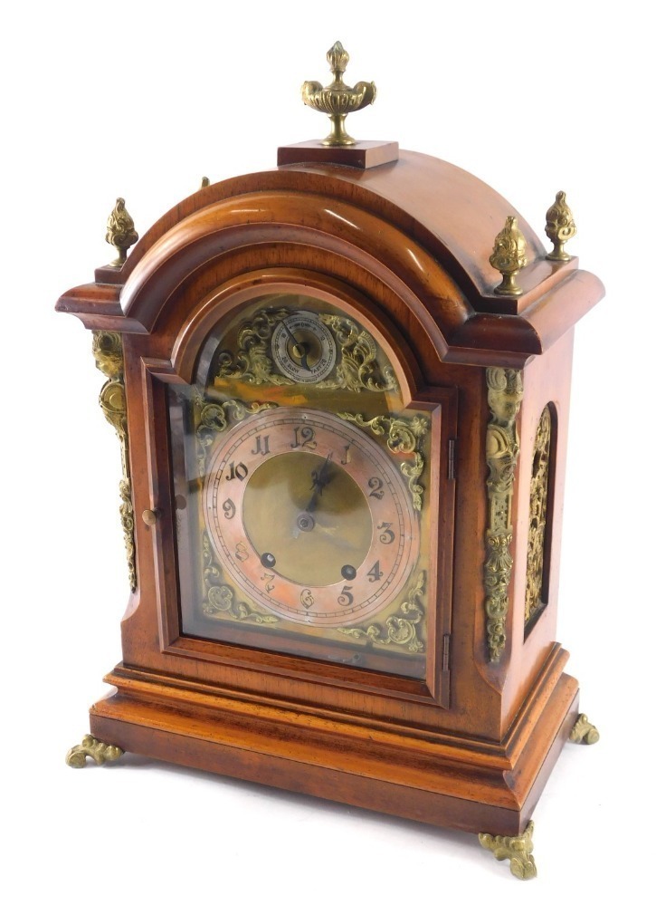 A late 19thC walnut and gilt metal German mantel clock, the top applied ...