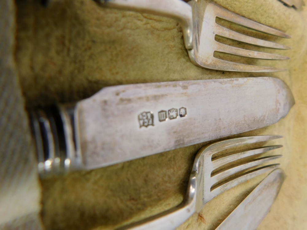 A set of six silver and stained green bone fish knives and forks ...