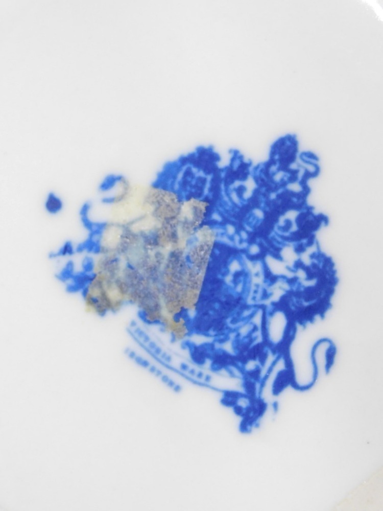 A reproduction blue and white porcelain stick stand, transfer decorated ...