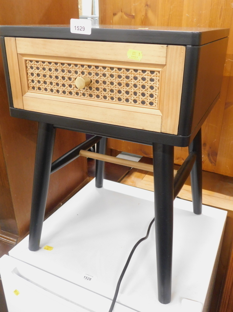 A modern side table, with a single drawer inset with caning turned legs ...