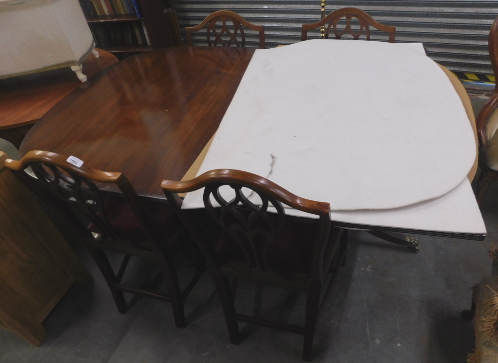 A reproduction Regency twin pedestal dining table and four chairs.