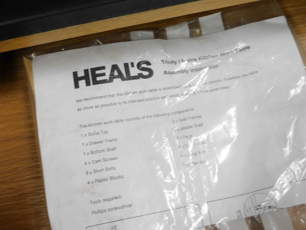 A Heels light oak and black stone topped kitchen worktable, with three ...