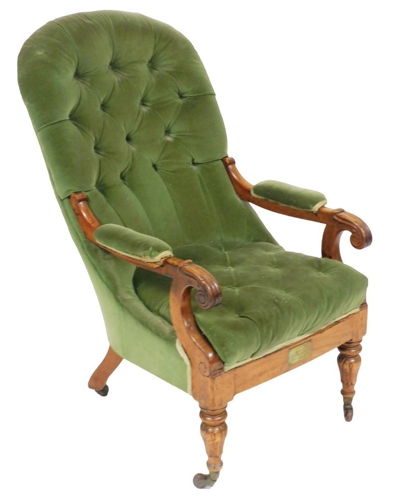 A Victorian mahogany spoon back armchair, upholstered in button back ...