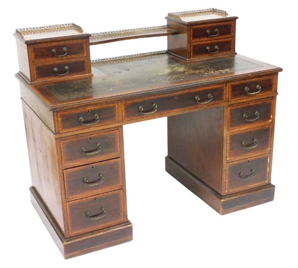 A late Victorian mahogany and satinwood cross banded twin pedestal desk ...