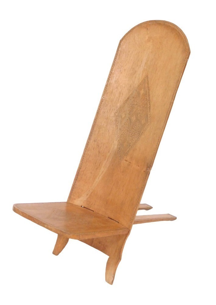 An African carved wood palaver chair, 98cm high, 37cm wide.