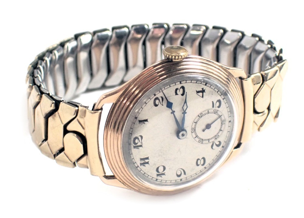 A 9ct gold gent's wristwatch, with a silvered numeric dial with blue ...