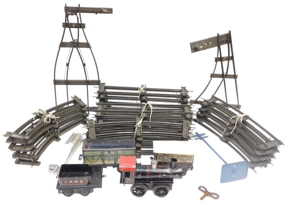 A Bing gauge 1 0-4-0 tinplate clockwork locomotive and LNWR tender ...
