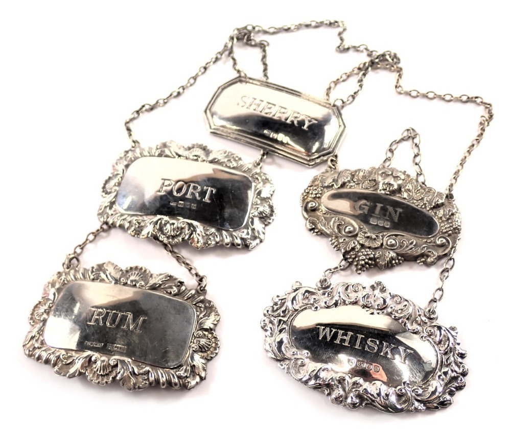 Five silver decanter labels, varying dates and designs, to include four ...